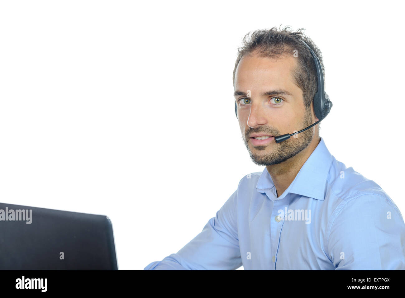 Handsome customer service operator wearing a headset on white ...