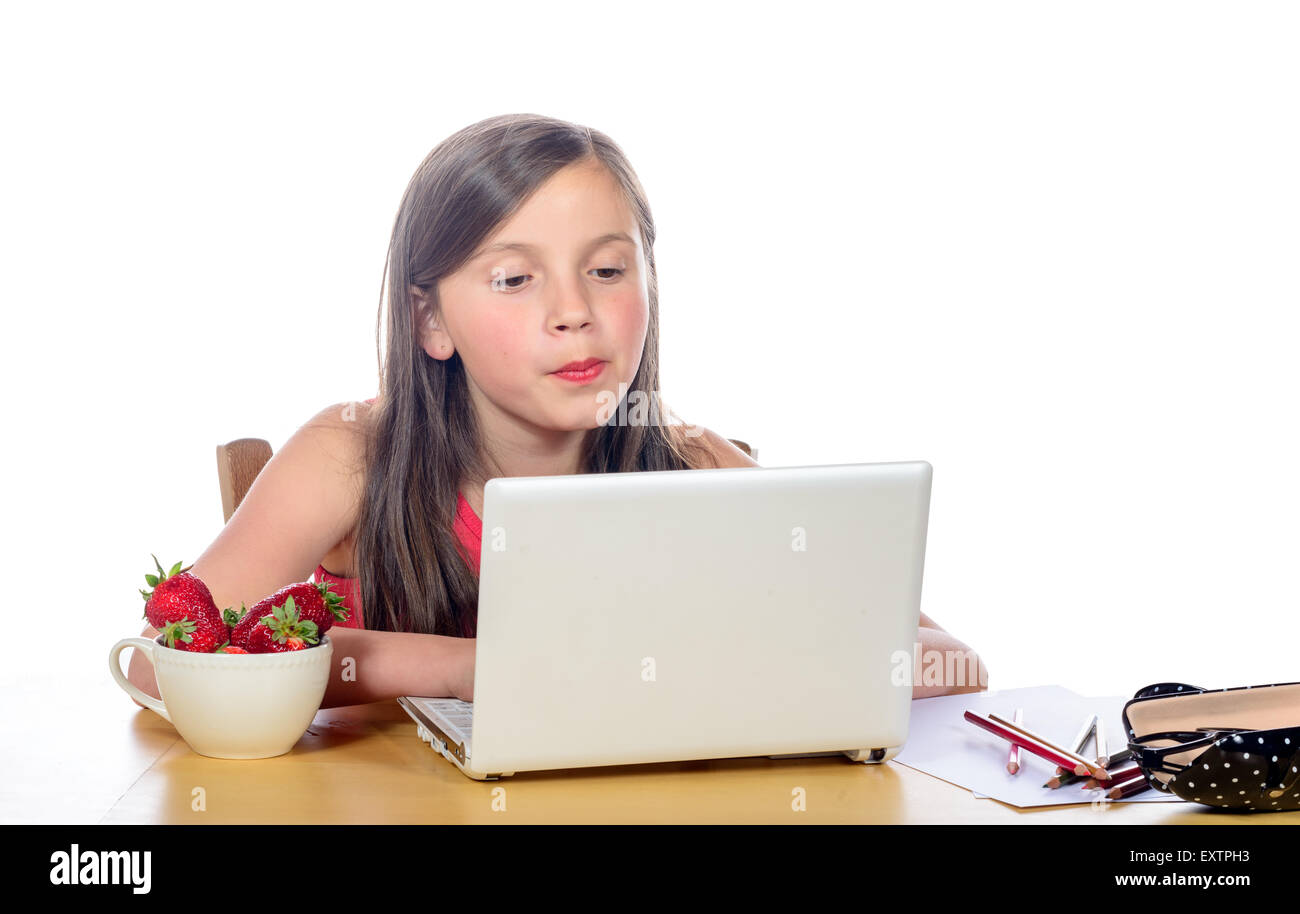 a little girl doing her homework on her computer Stock Photo - Alamy
