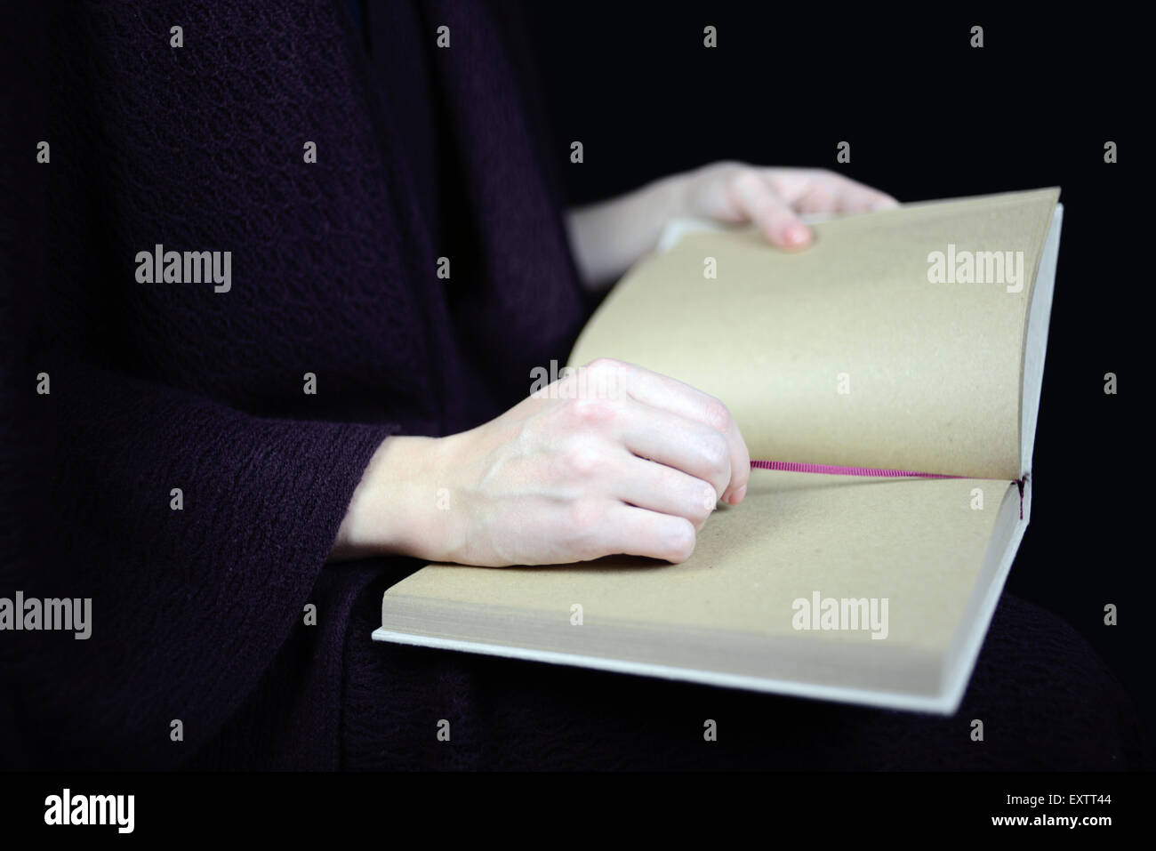 Hands holding book hi-res stock photography and images - Alamy