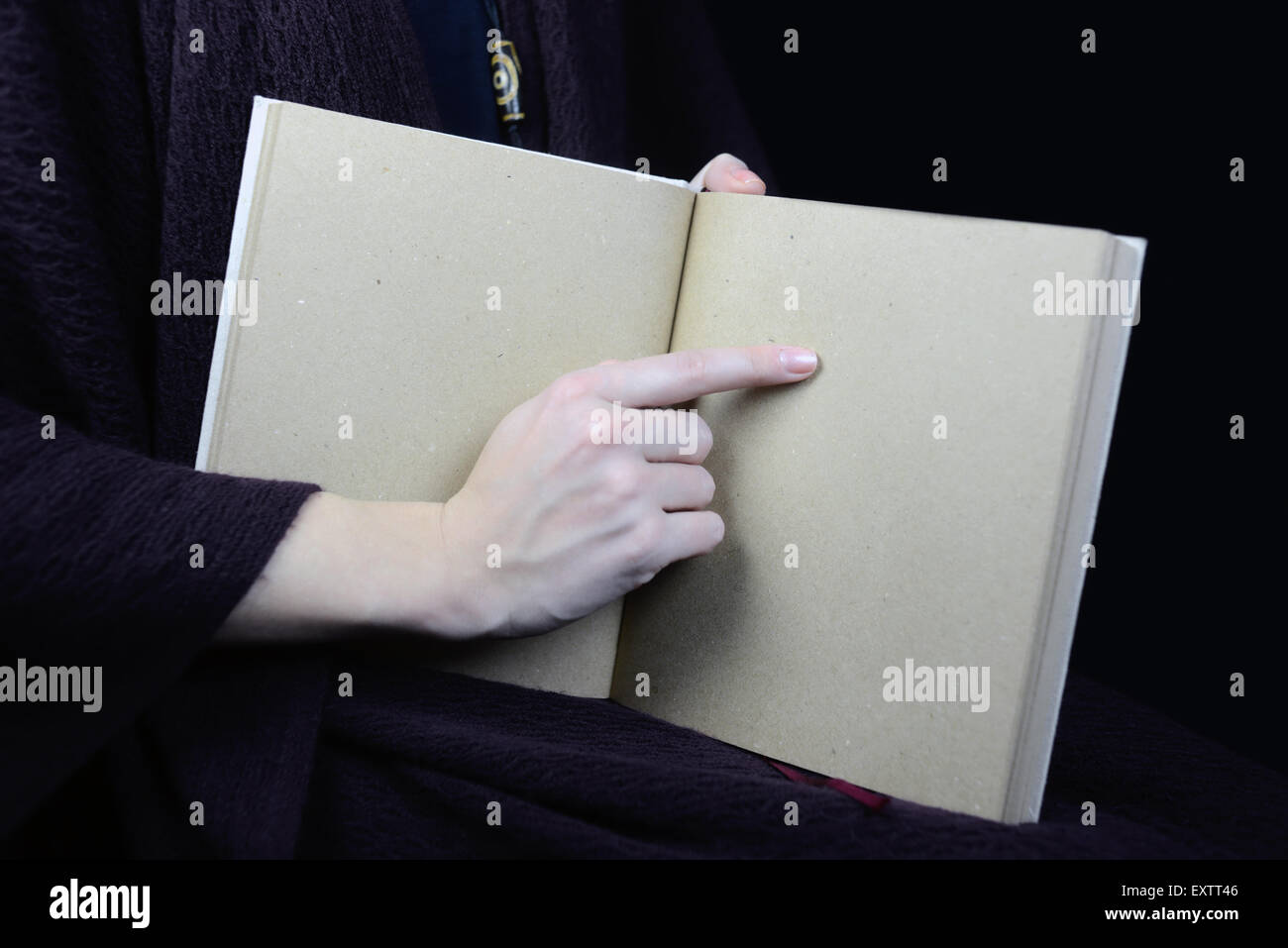 Hands holding book hi-res stock photography and images - Alamy