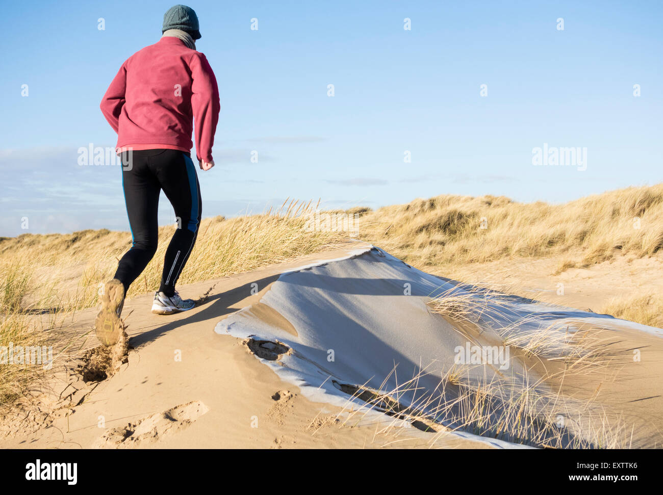 Athlete running on sand dunes hi-res stock photography and images - Alamy