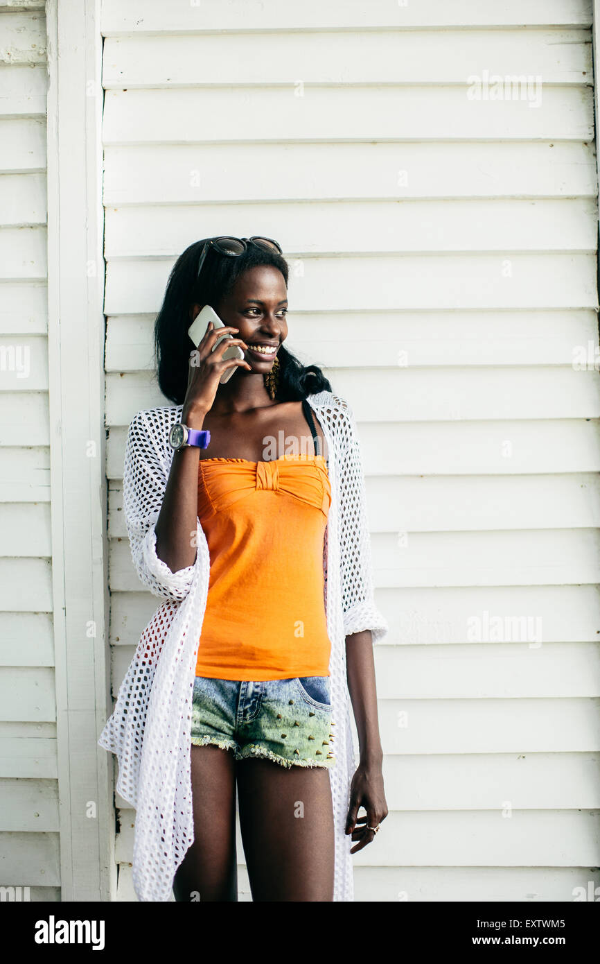 Young african woman with mobile phone Stock Photo - Alamy