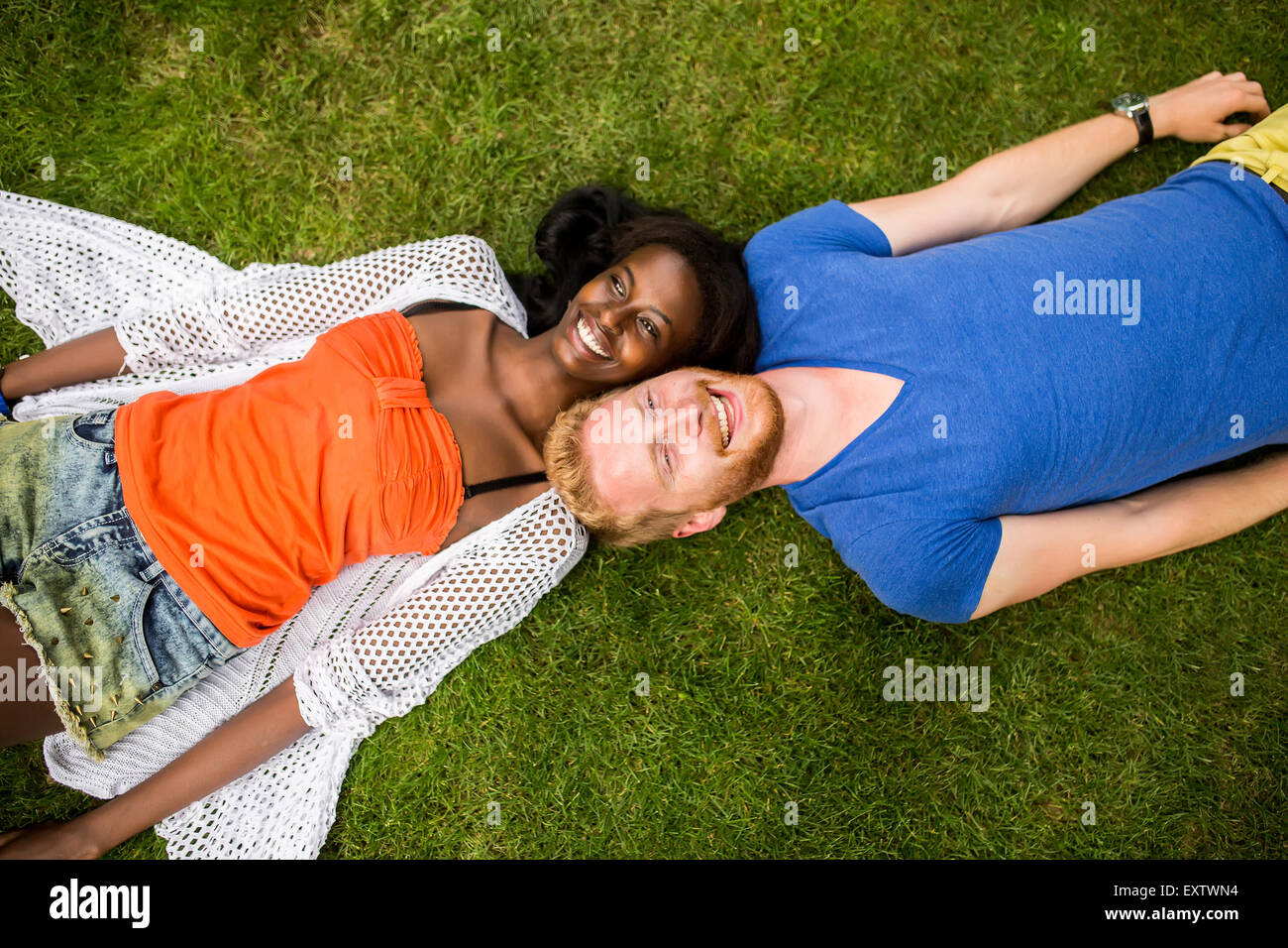 Multiracial couple in the park Stock Photo - Alamy