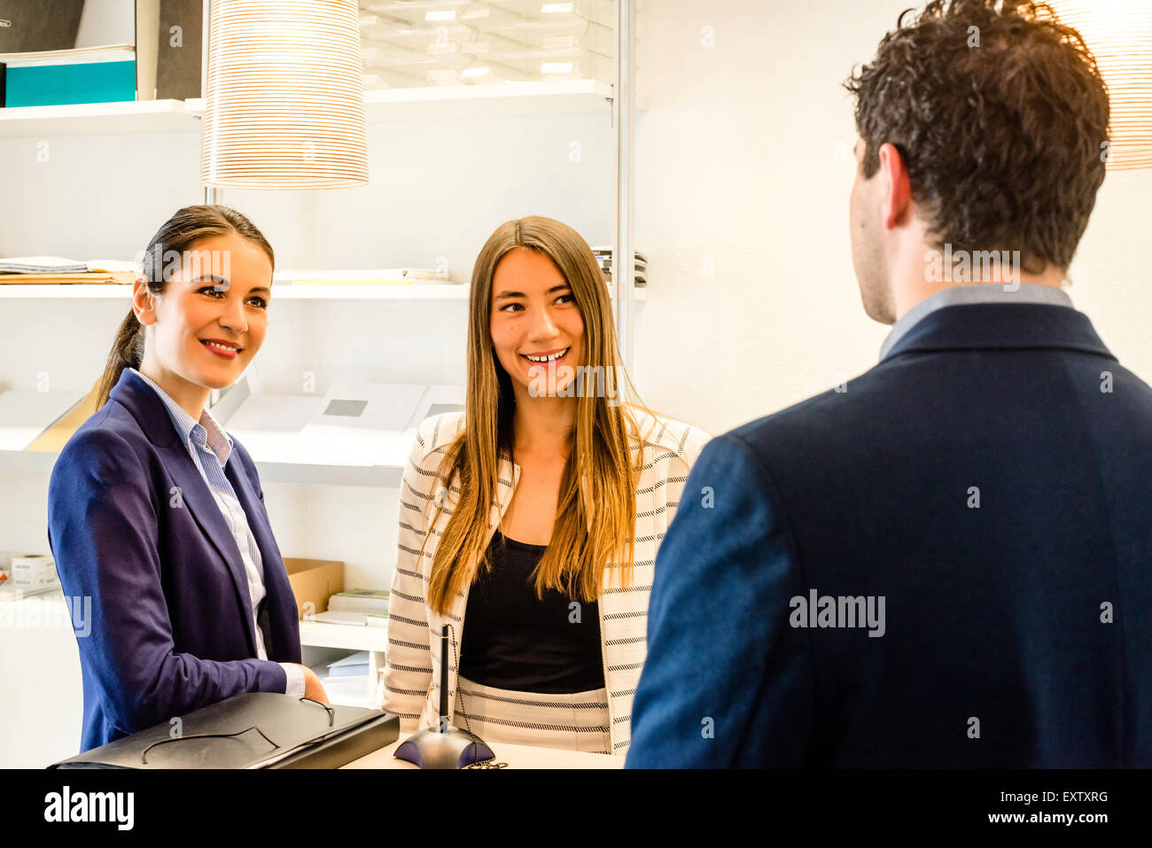 Conversation at the office reception Stock Photo - Alamy