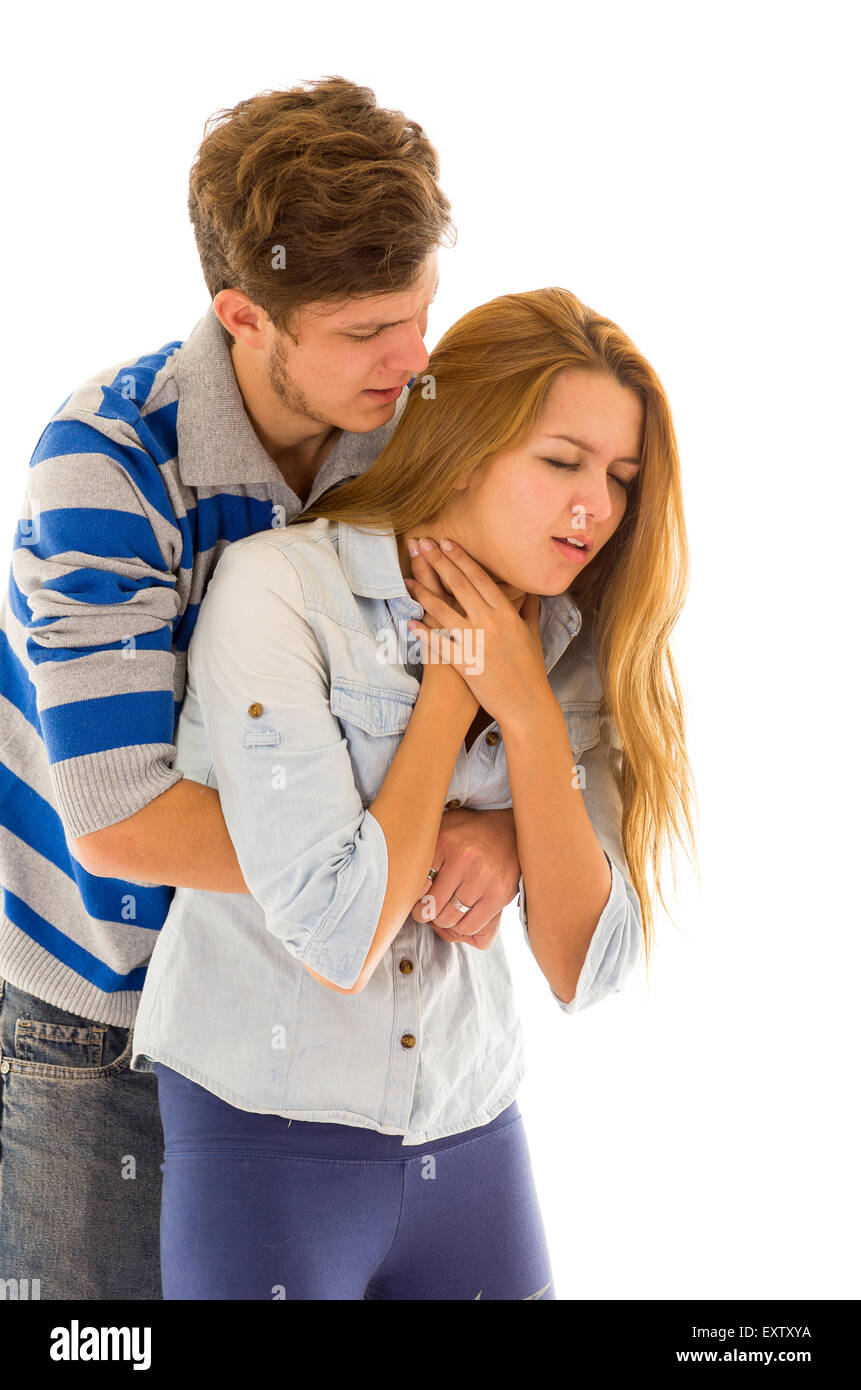 Couple demonstrating first aid techniques by man performing heimlich on ...