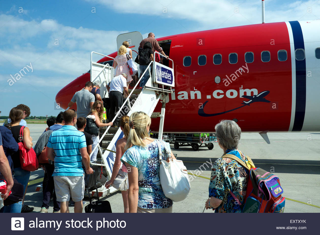 Airline passengers boarding a Norwegian (a low cost airline) service ...