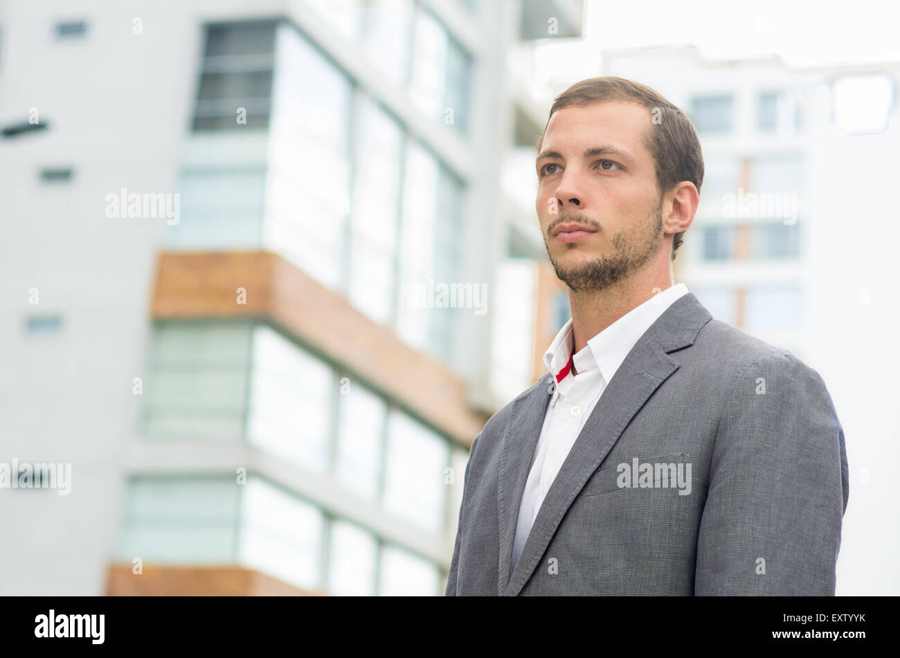 Man formal clothing in urban environment looking forward concentrated ...