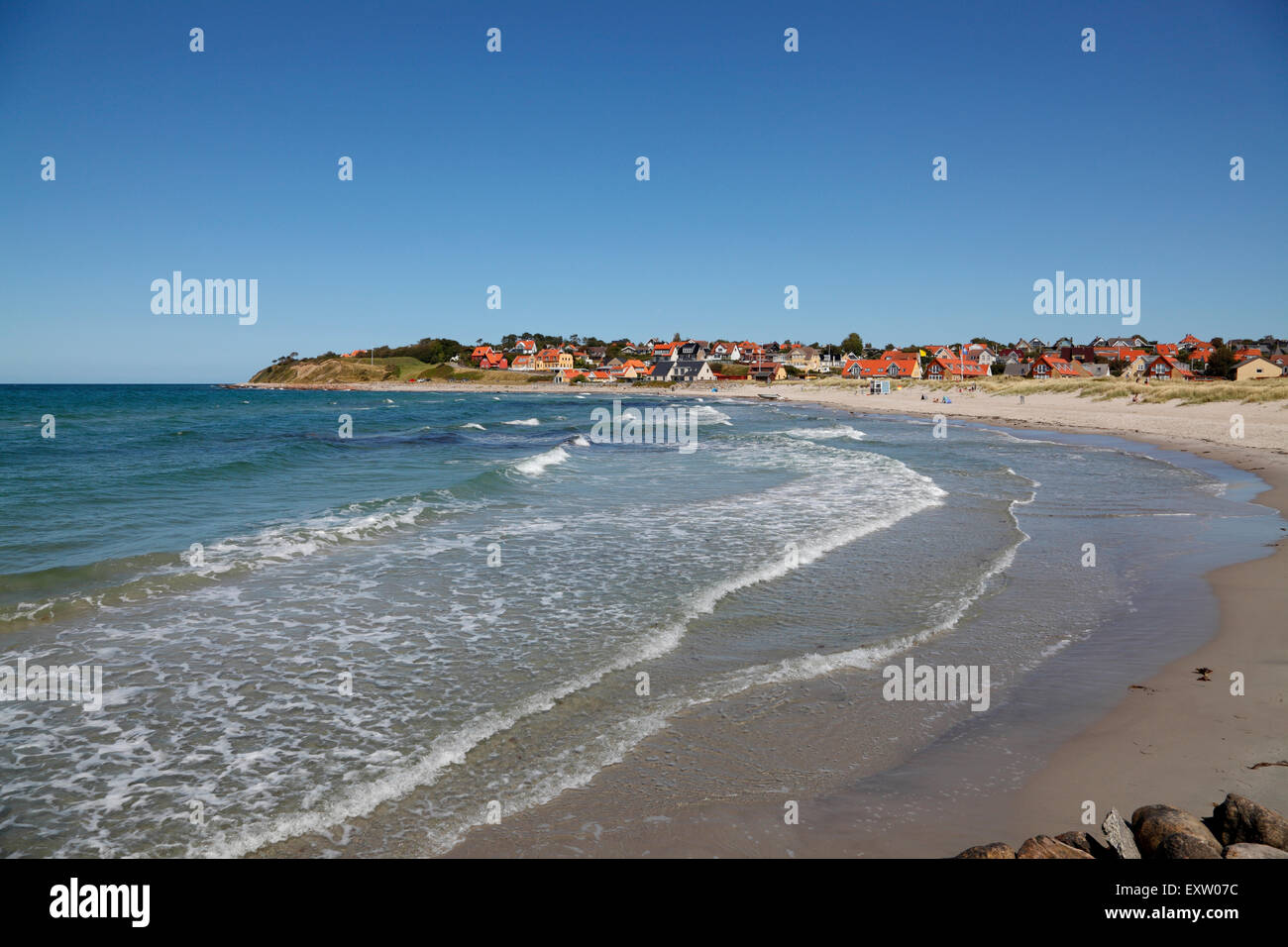 Surf at Hundested Beach on a summer's day, to the left the 30 m tall ...
