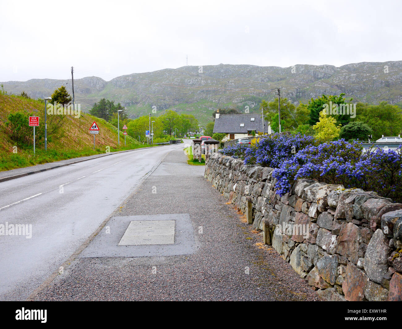 The A832 road going through the village of Poolewe, Ross-Shire ...