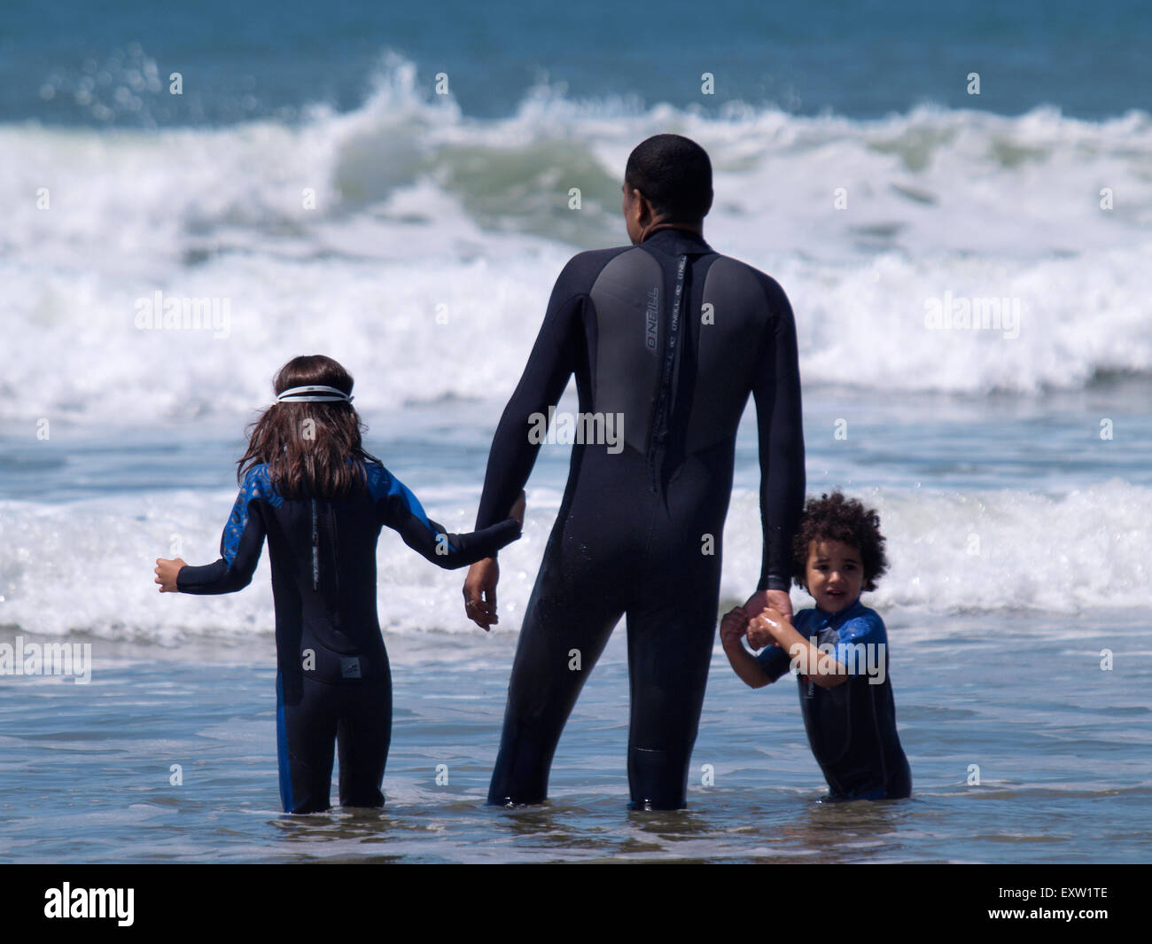 Children playing in the sea hi-res stock photography and images - Alamy