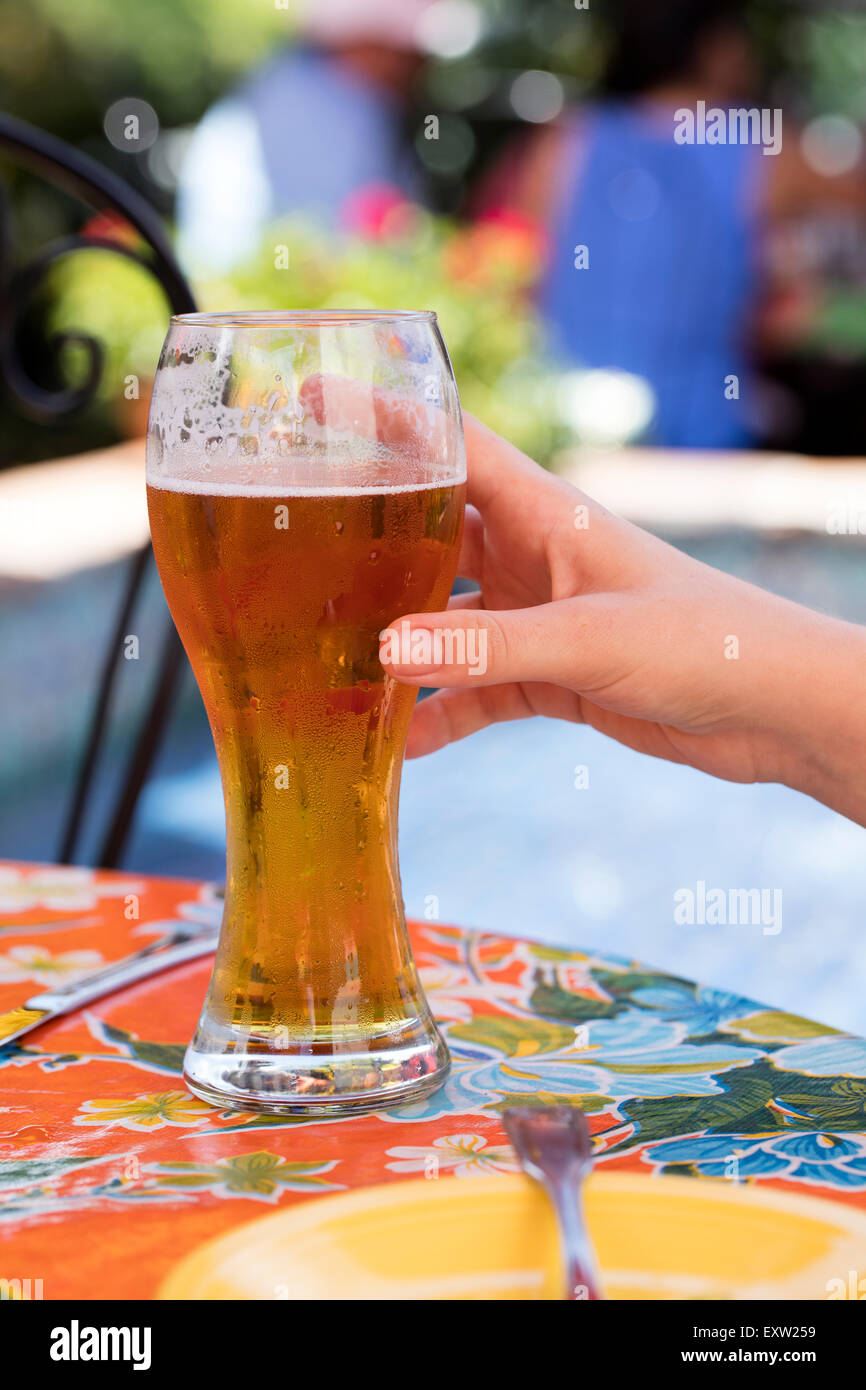 Refreshing beer ordered before dinner at a local restaurant Stock Photo ...