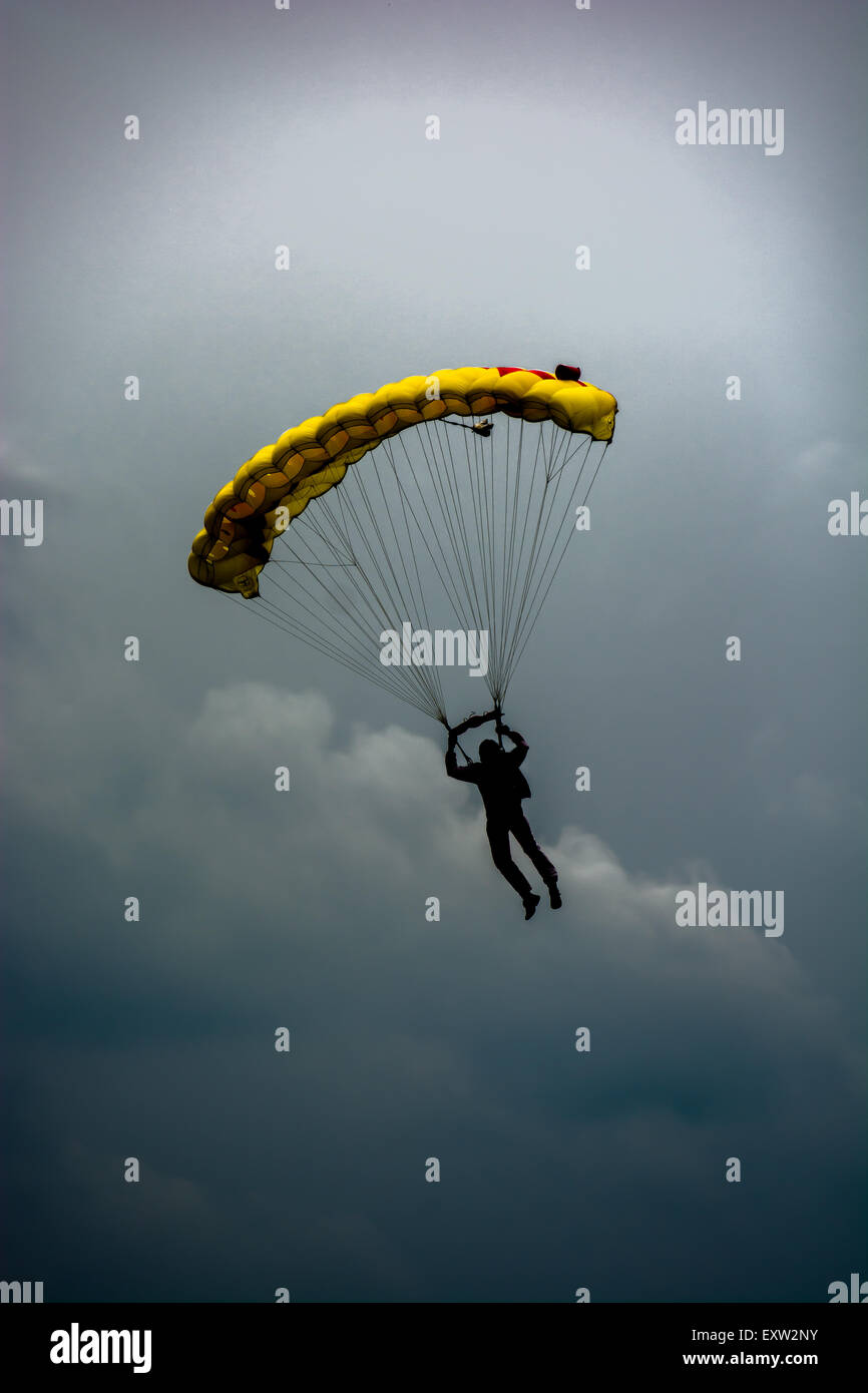 Parachute Flying High In The Clouds Stock Photo - Alamy