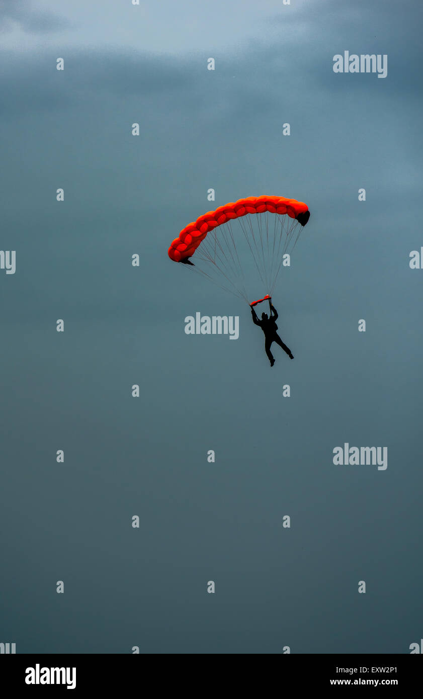 Parachute Flying High In The Clouds Stock Photo - Alamy