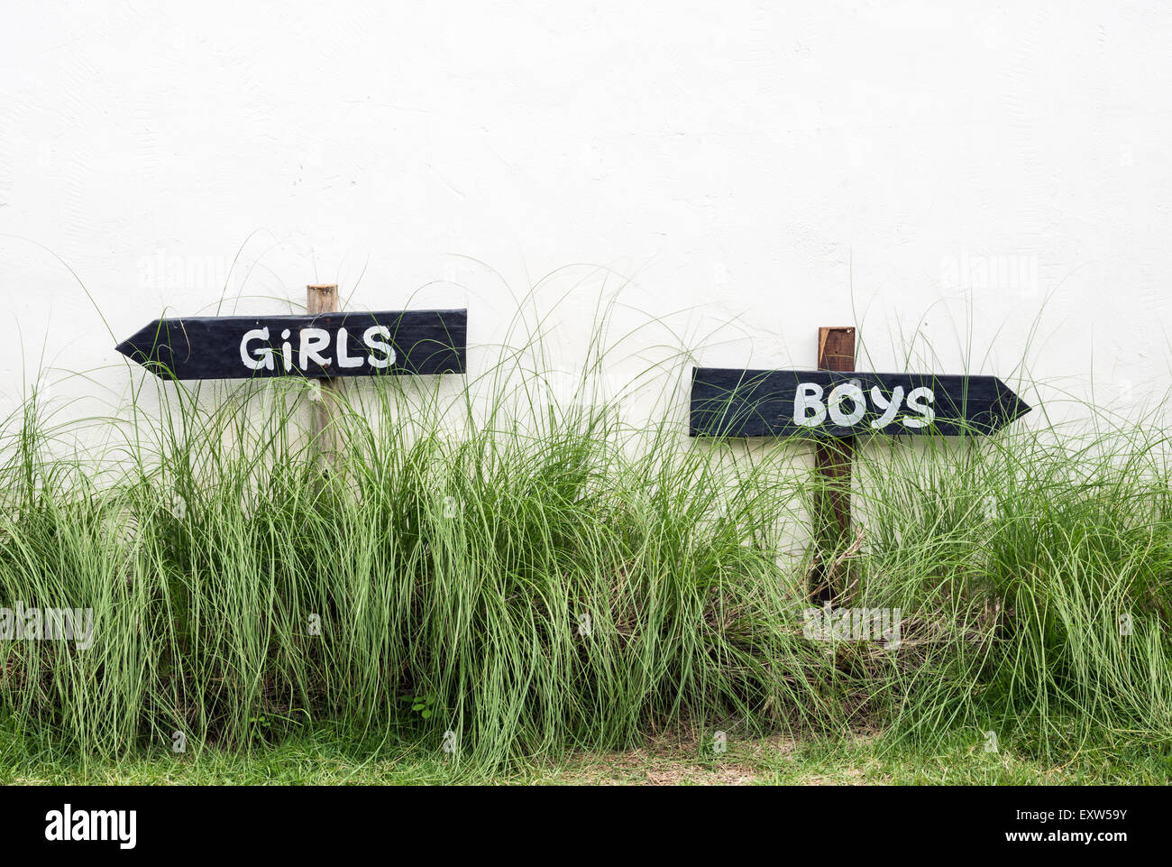 Wooden arrow to the public toilet in countryside Stock Photo - Alamy