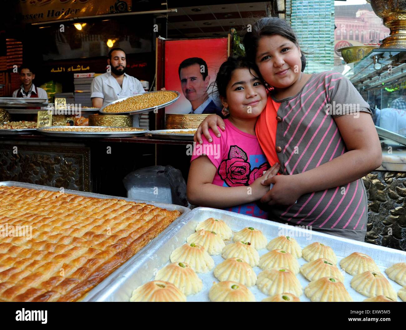Damascus, Syria. 16th July, 2015. Syrian kids pose at a marketplace ...
