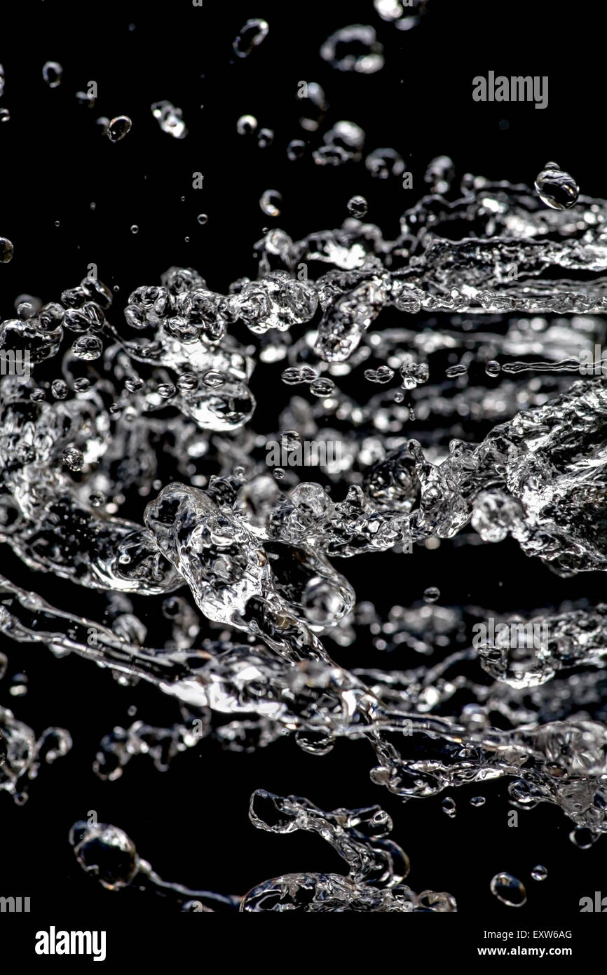 Water stream freezed in the air water drops levitation Stock Photo - Alamy