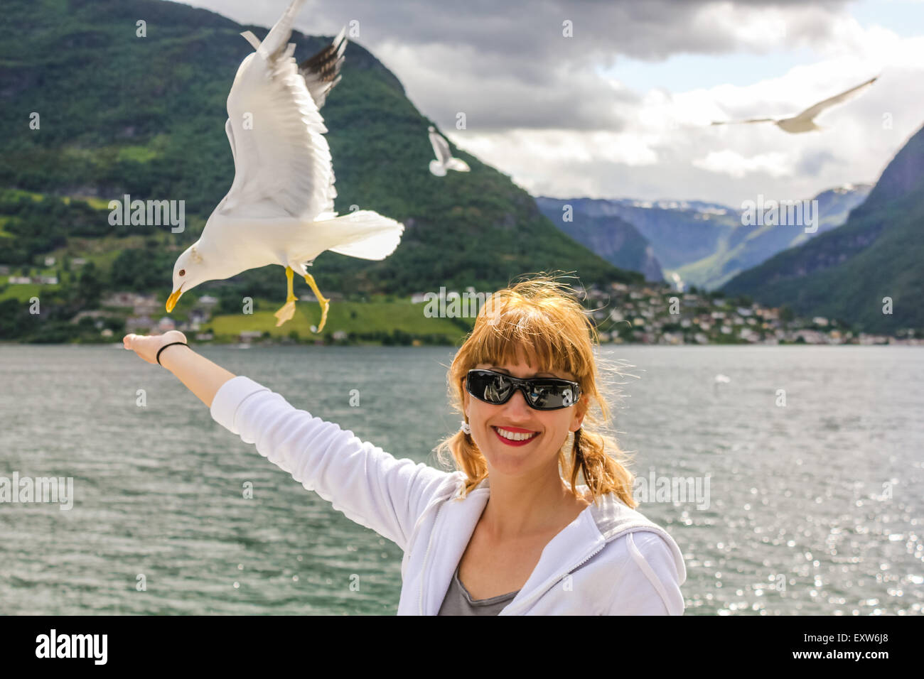 Woman enjoy seagull Stock Photo - Alamy