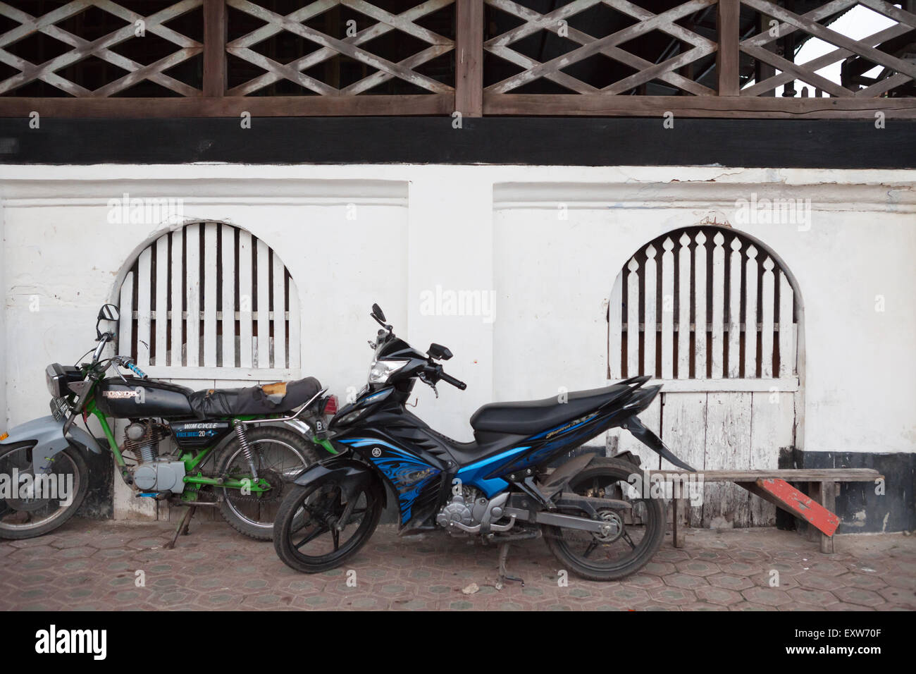 Motorcycles parked in front of a house belonged to "kapiten", a person ...