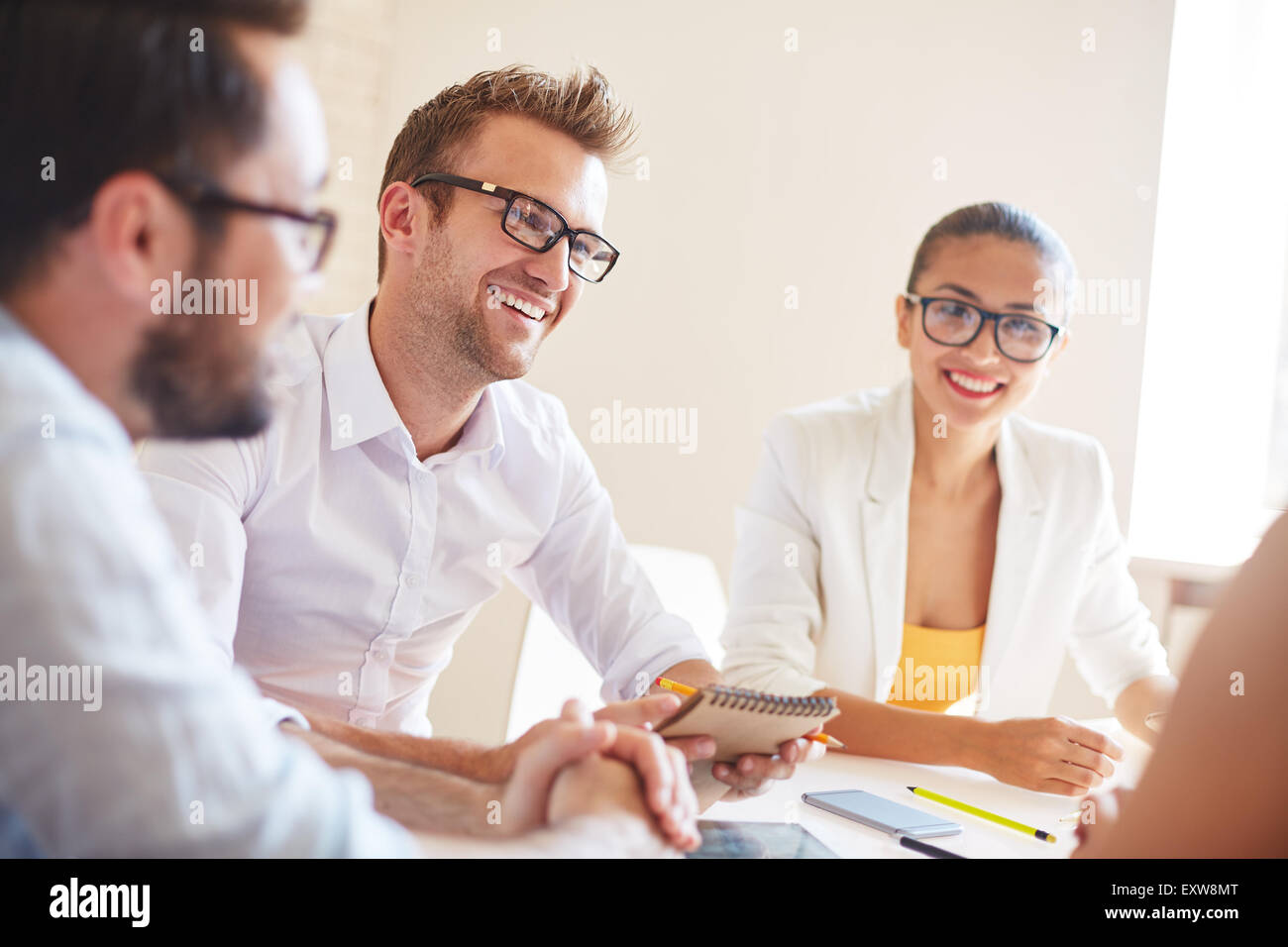 Group of managers planning work and interacting at meeting Stock Photo ...
