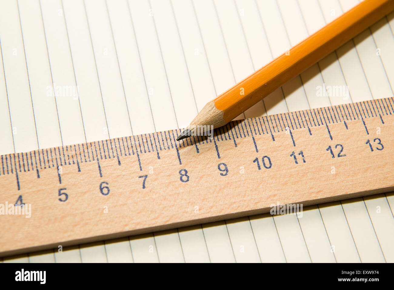 Notepad with a recording sheet, pencil and wooden ruler on the old ...