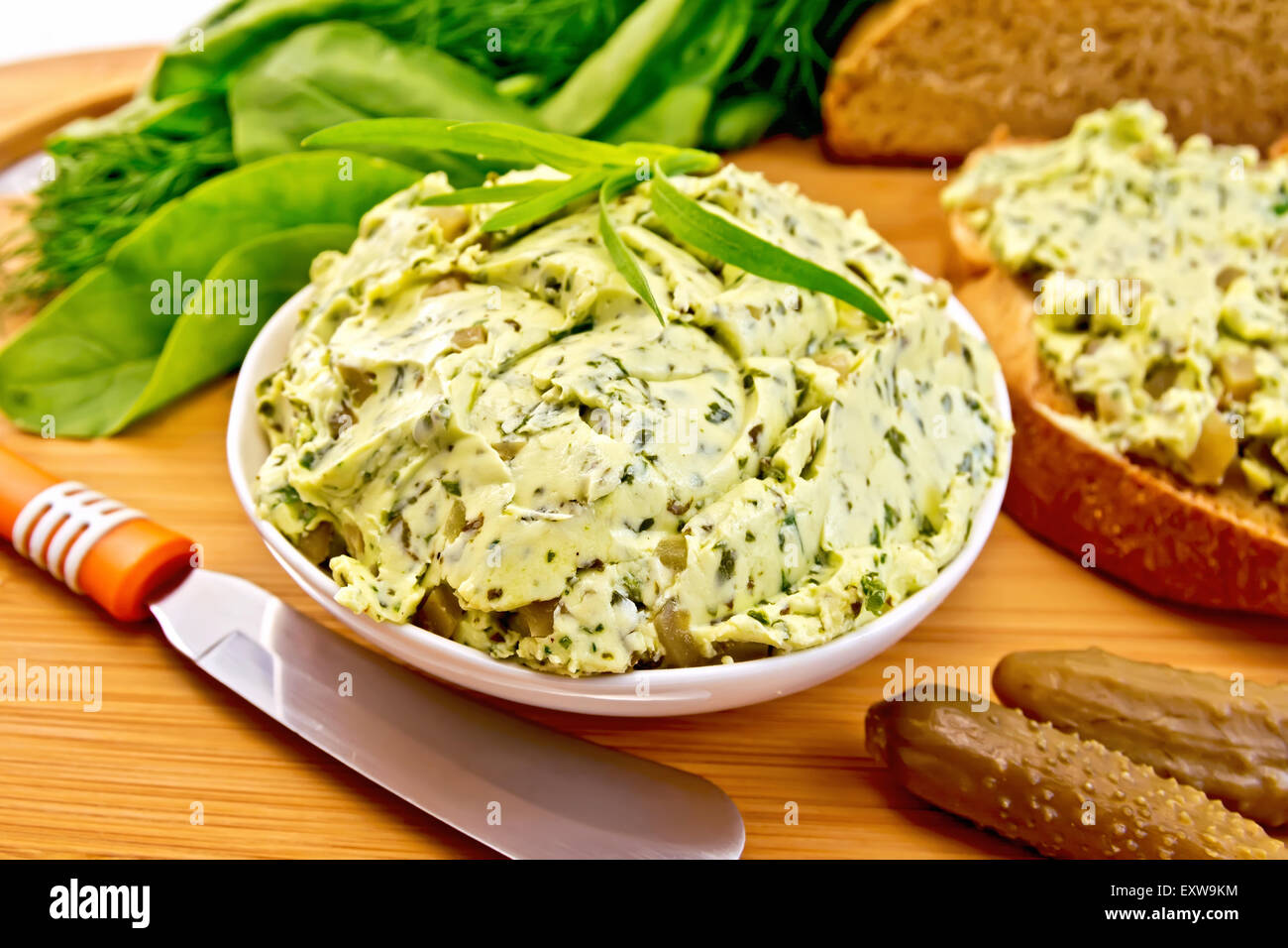 Butter with spinach and herbs in bowl on board Stock Photo - Alamy