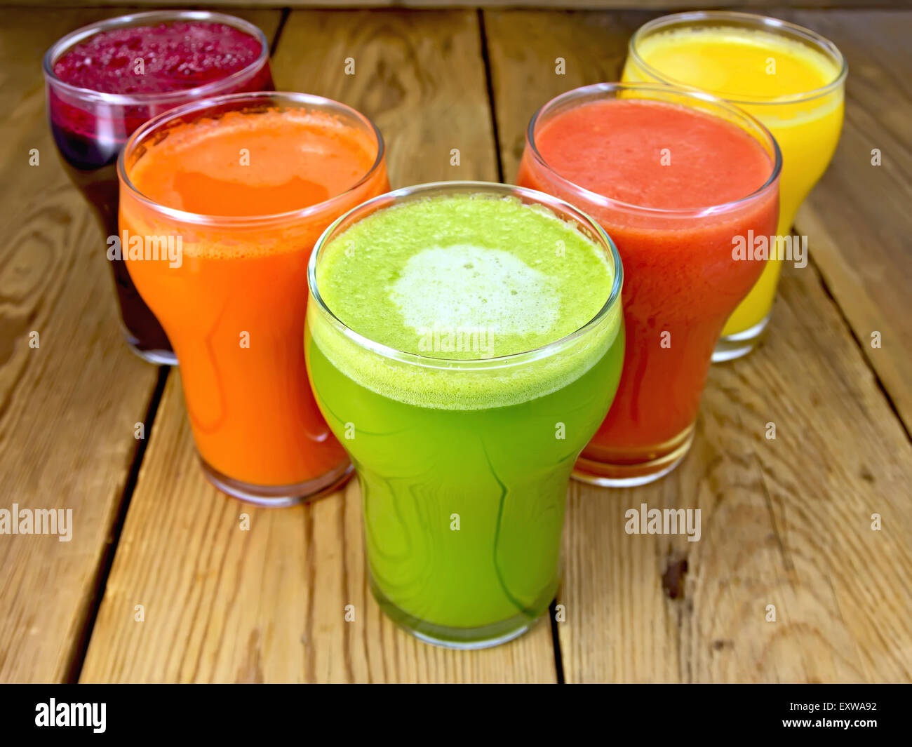 Juice vegetable in five glassful on board Stock Photo - Alamy