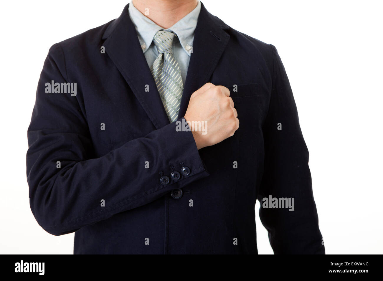 Man making oath with fist on chest Stock Photo - Alamy