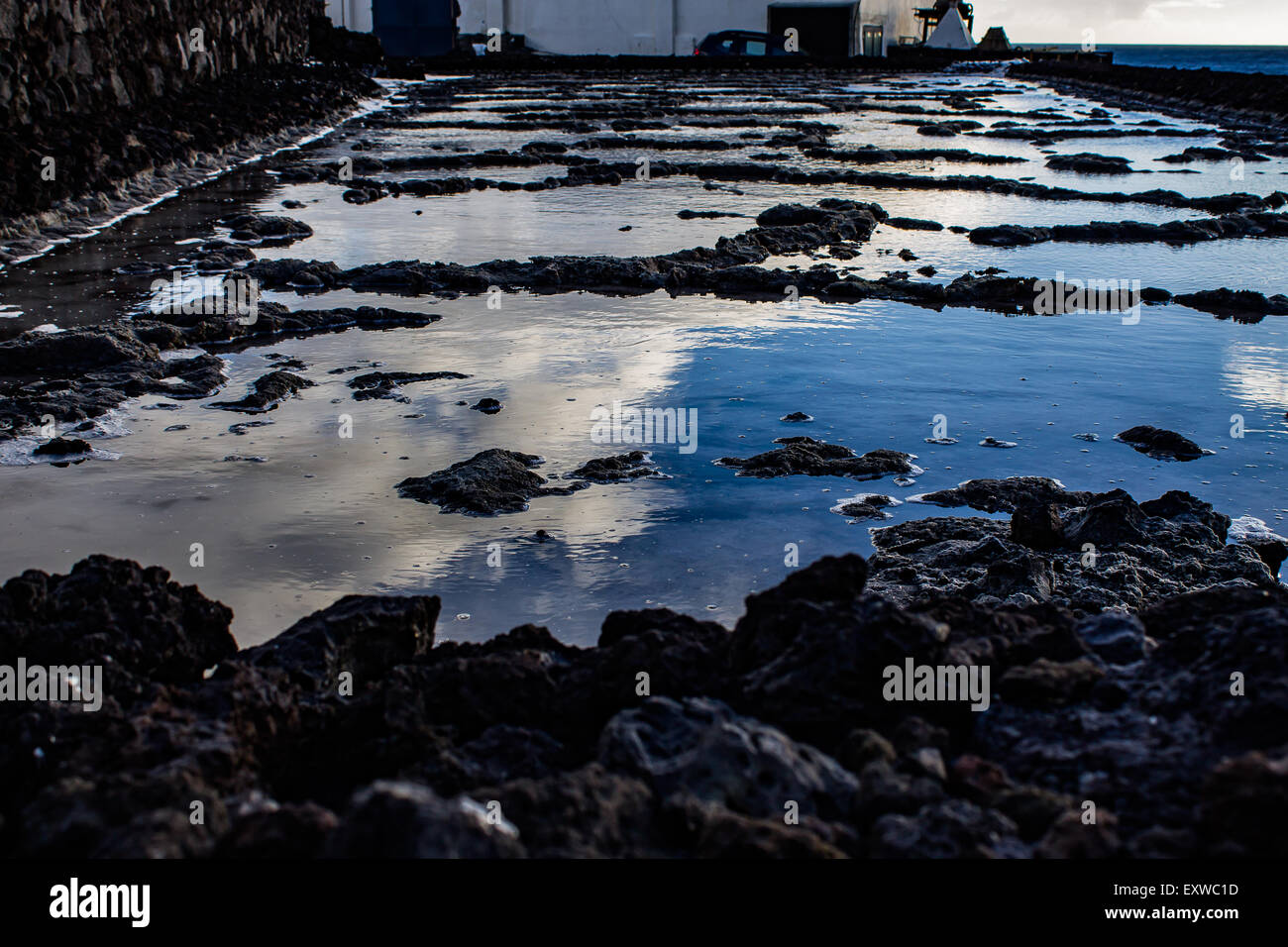 A reflection of the sky and clouds on the salt pans of Fuencaliente, La ...