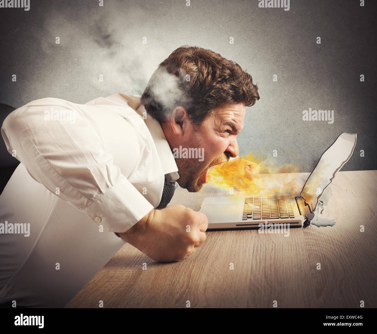 Angry businessman spits fire Stock Photo - Alamy