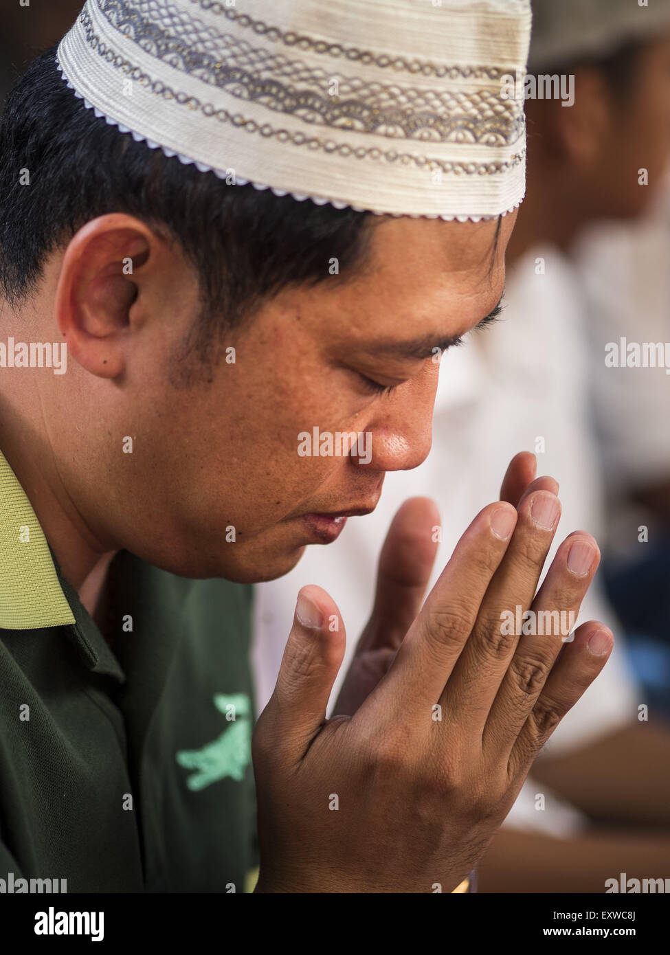 Bangkok, Thailand. 17th July, 2015. A man prays during Eid services at ...