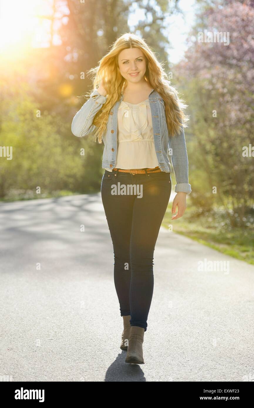 Young people walking in long hi-res stock photography and images - Alamy