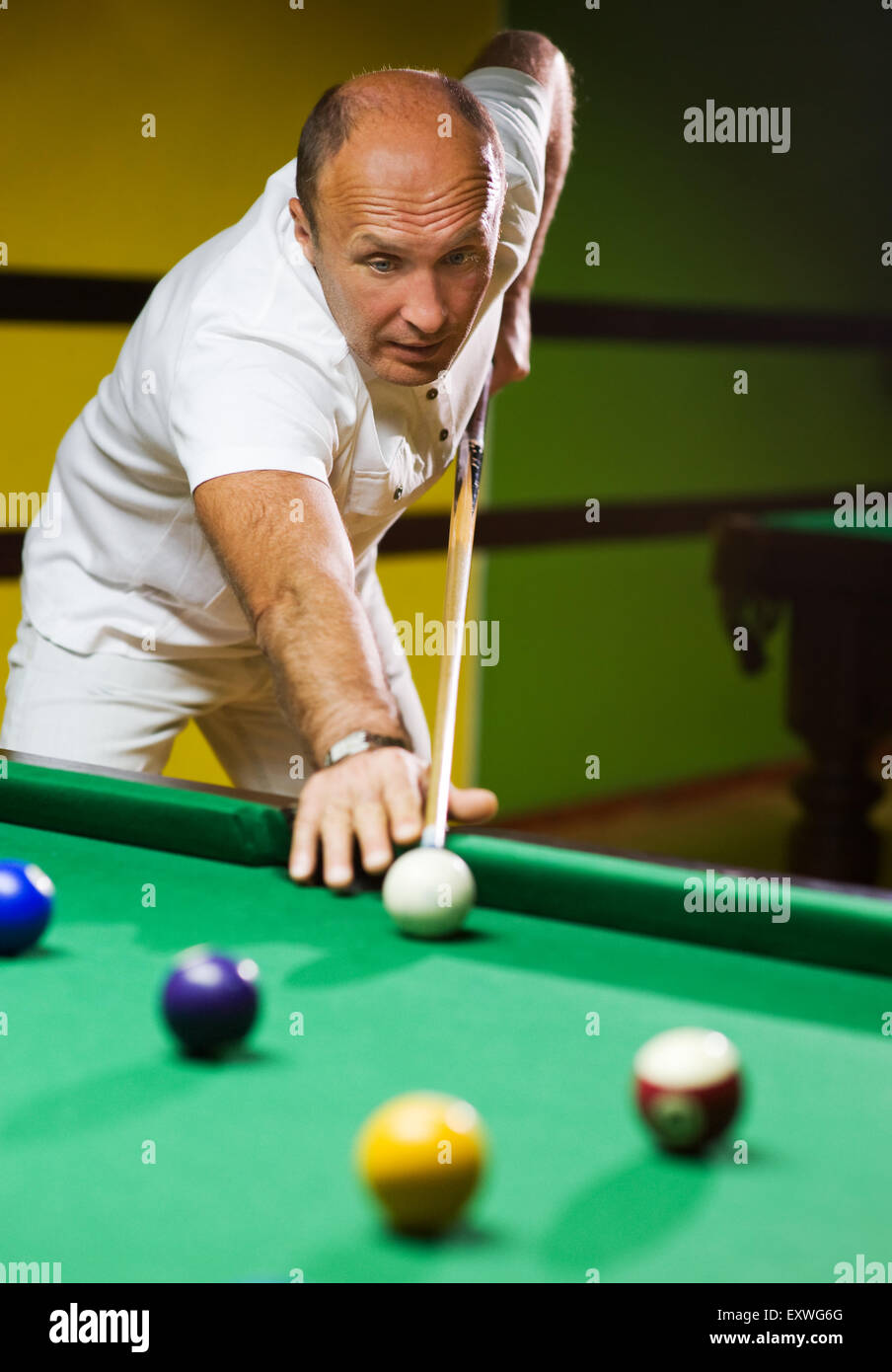Man playing billiards Stock Photo - Alamy