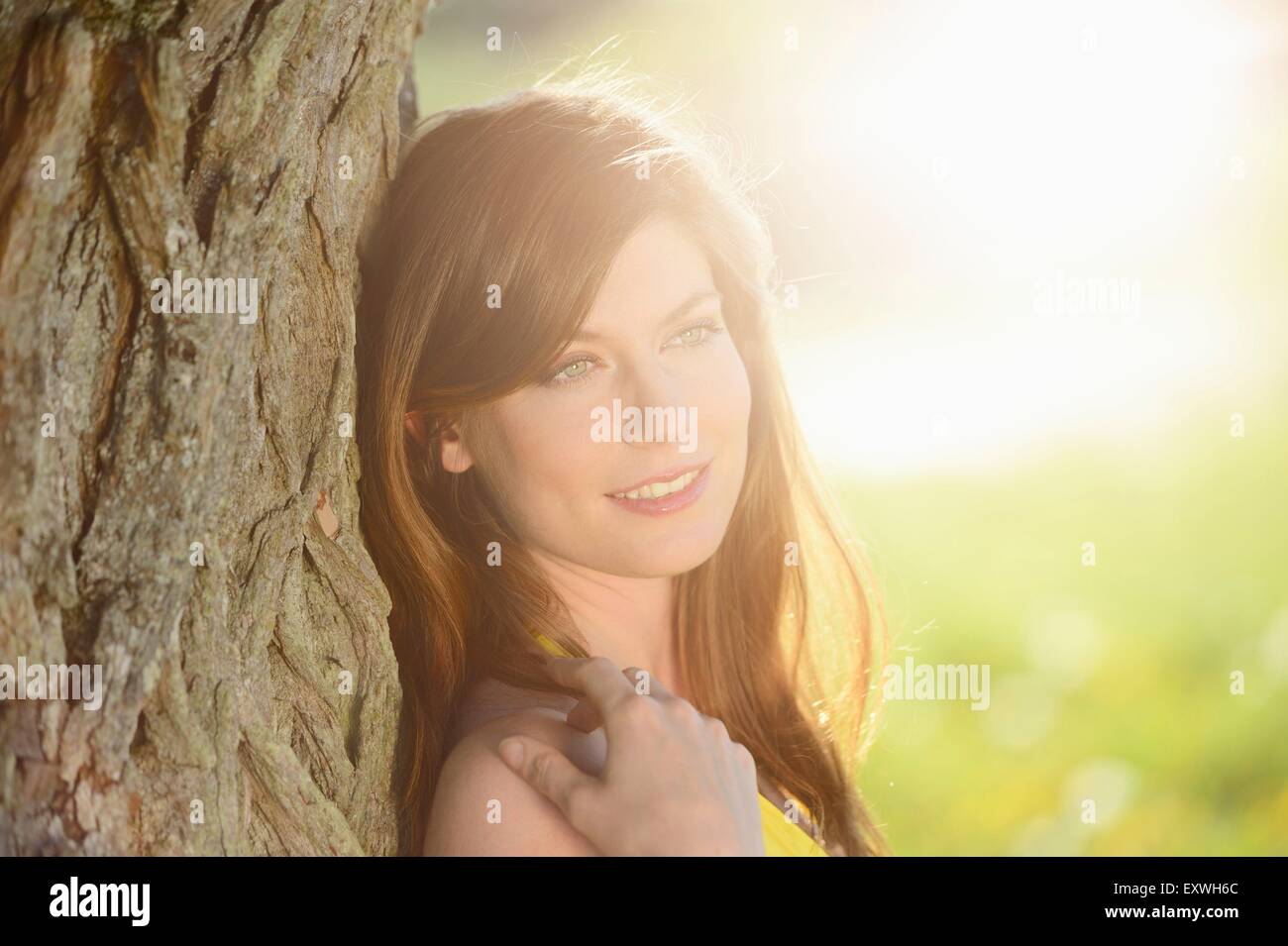 Young woman at a tree, Bavaria, Germany, Europe Stock Photo - Alamy