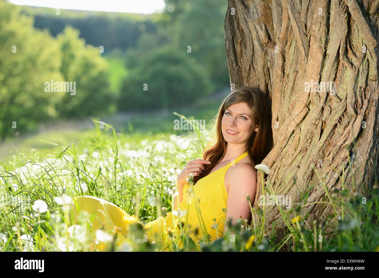 Woman and tree hi-res stock photography and images - Alamy