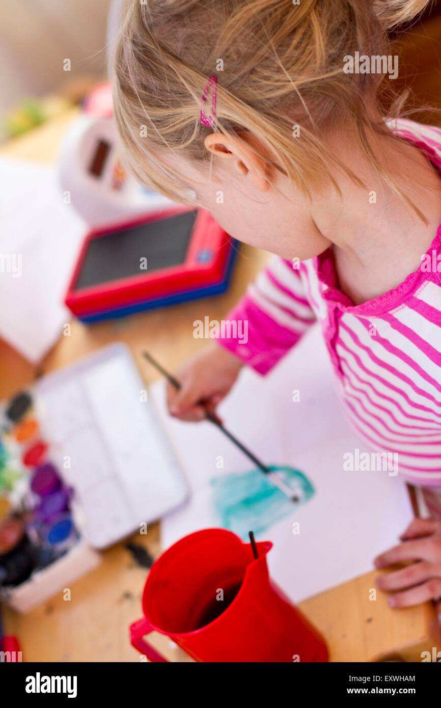 Girl painting a picture Stock Photo - Alamy