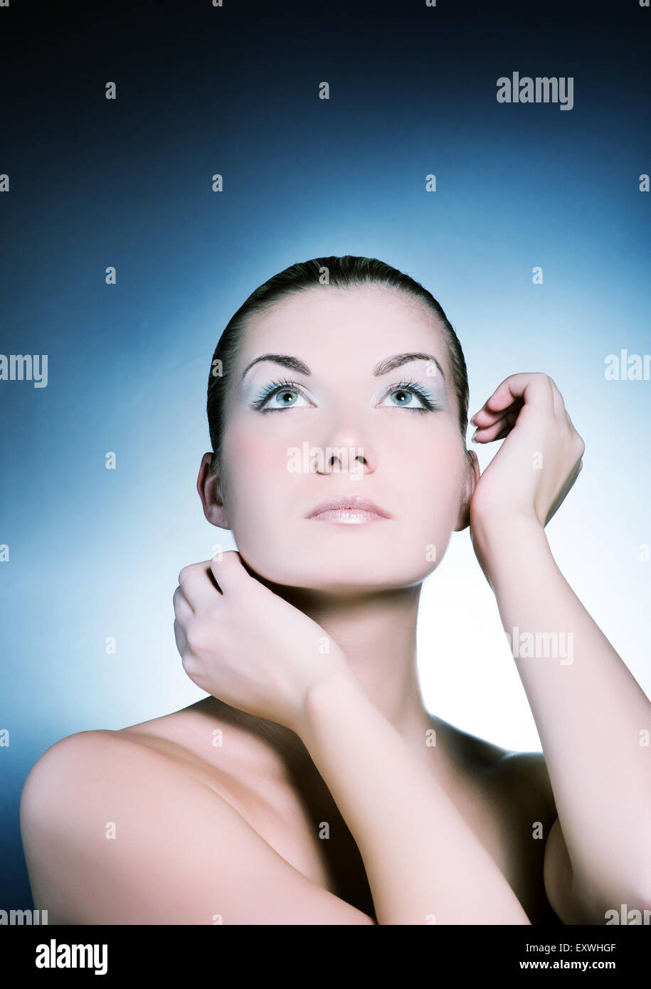 Beautiful young woman looking up Stock Photo - Alamy