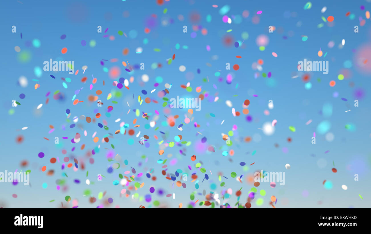 Coloured confetti flying in the blue sky Stock Photo - Alamy