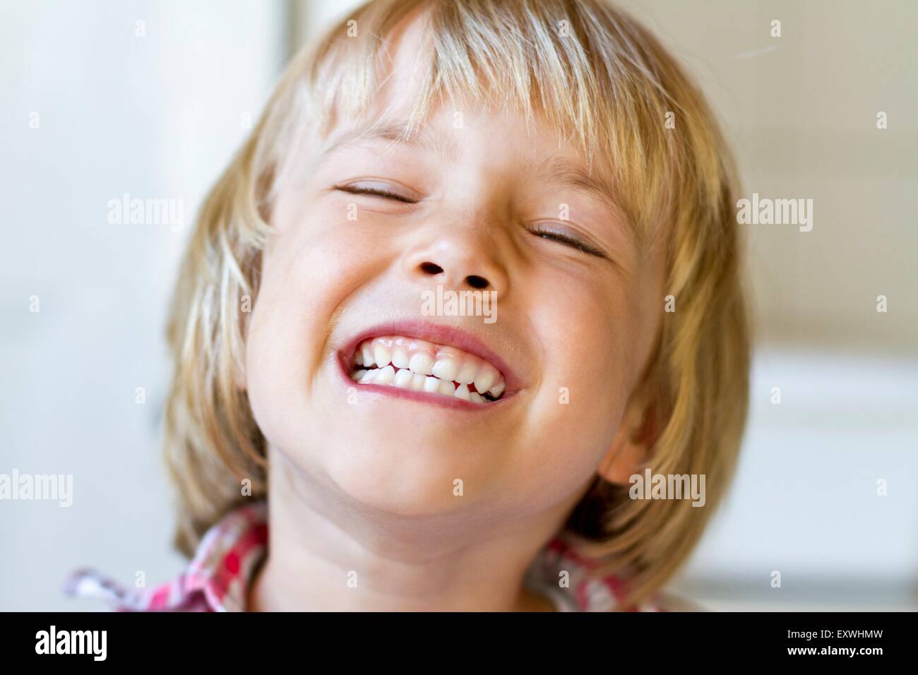 Girl laughing with eyes closed Stock Photo - Alamy