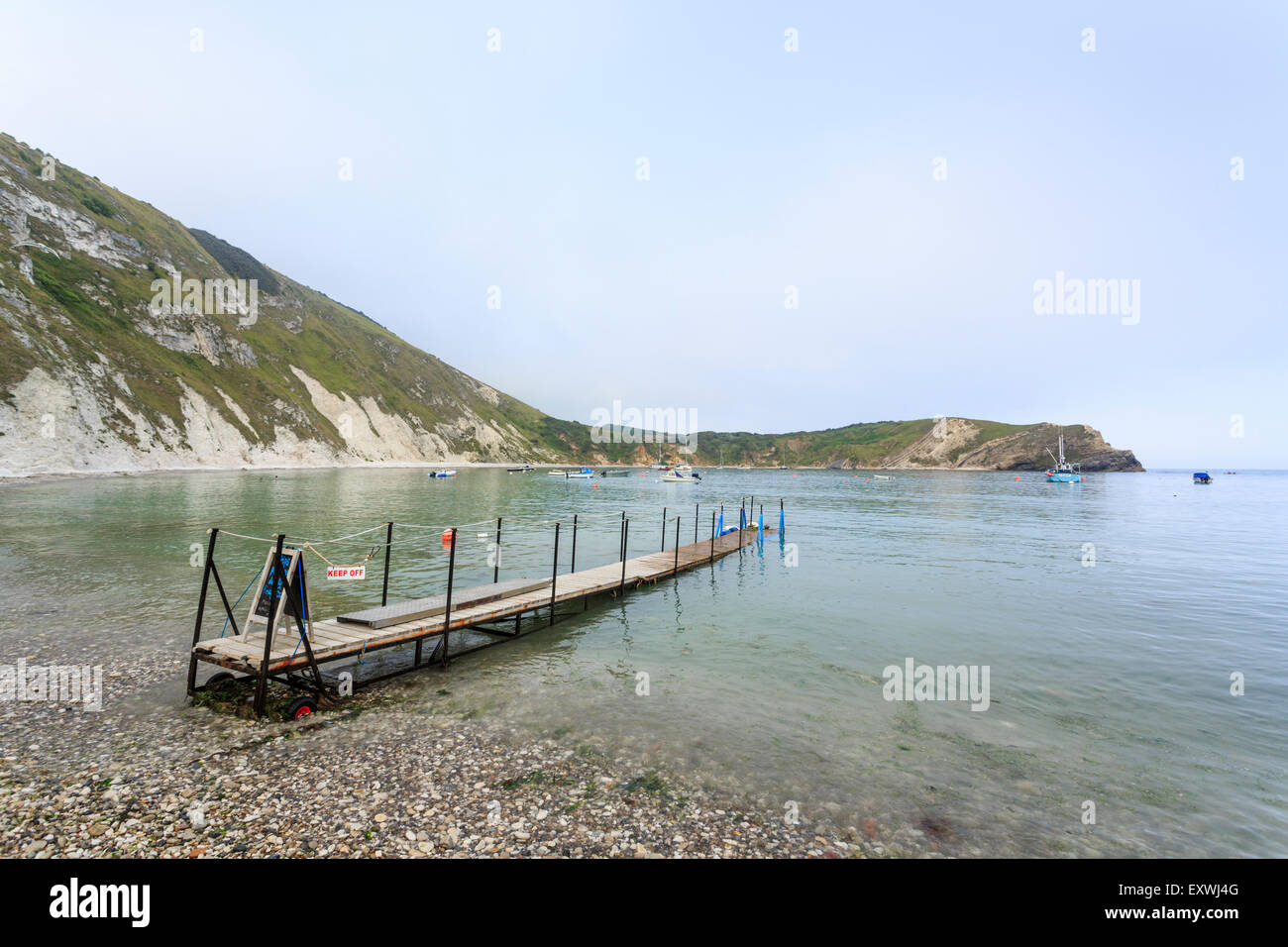 Movable pontoon in landscape of the seashore in Lulworth Cove bay with ...
