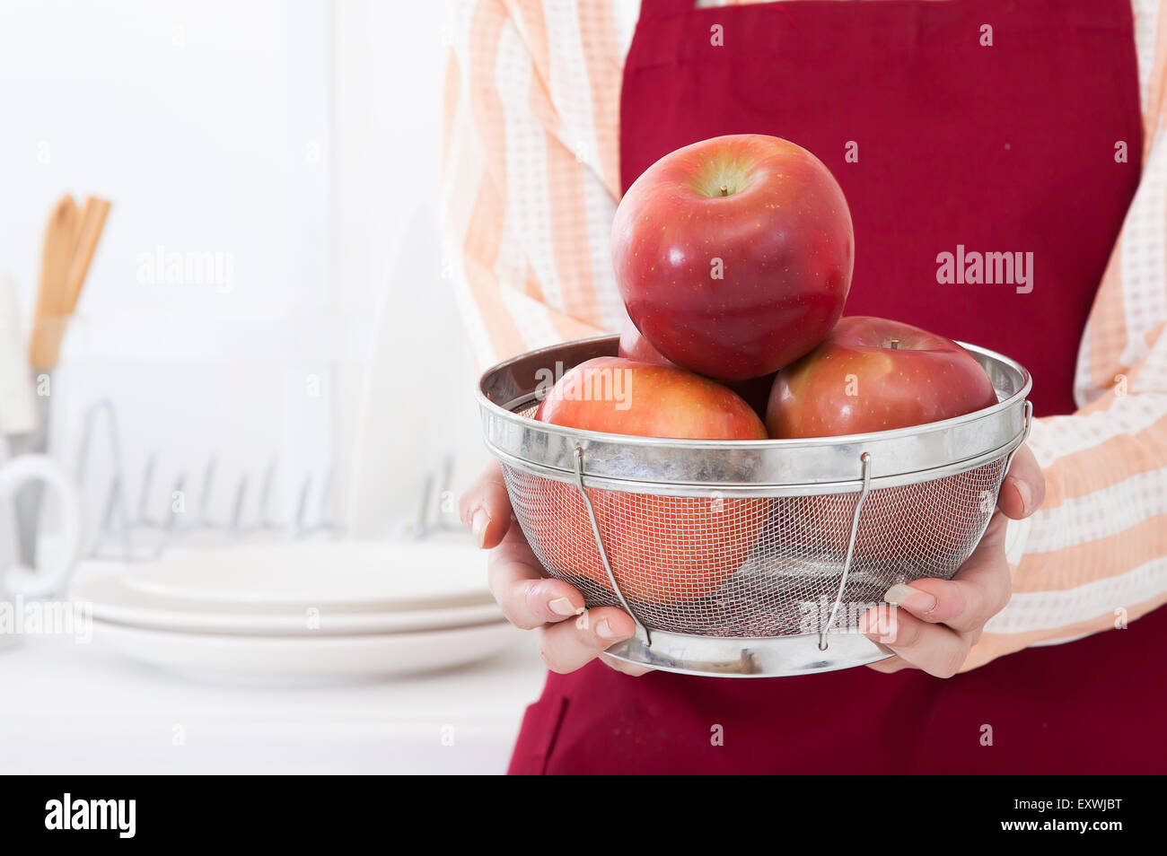 Human hands holding apples Stock Photo - Alamy