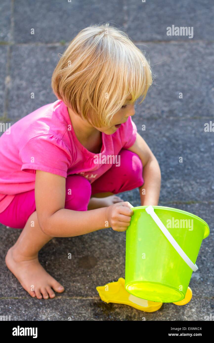 Girl playing outdoors Stock Photo - Alamy