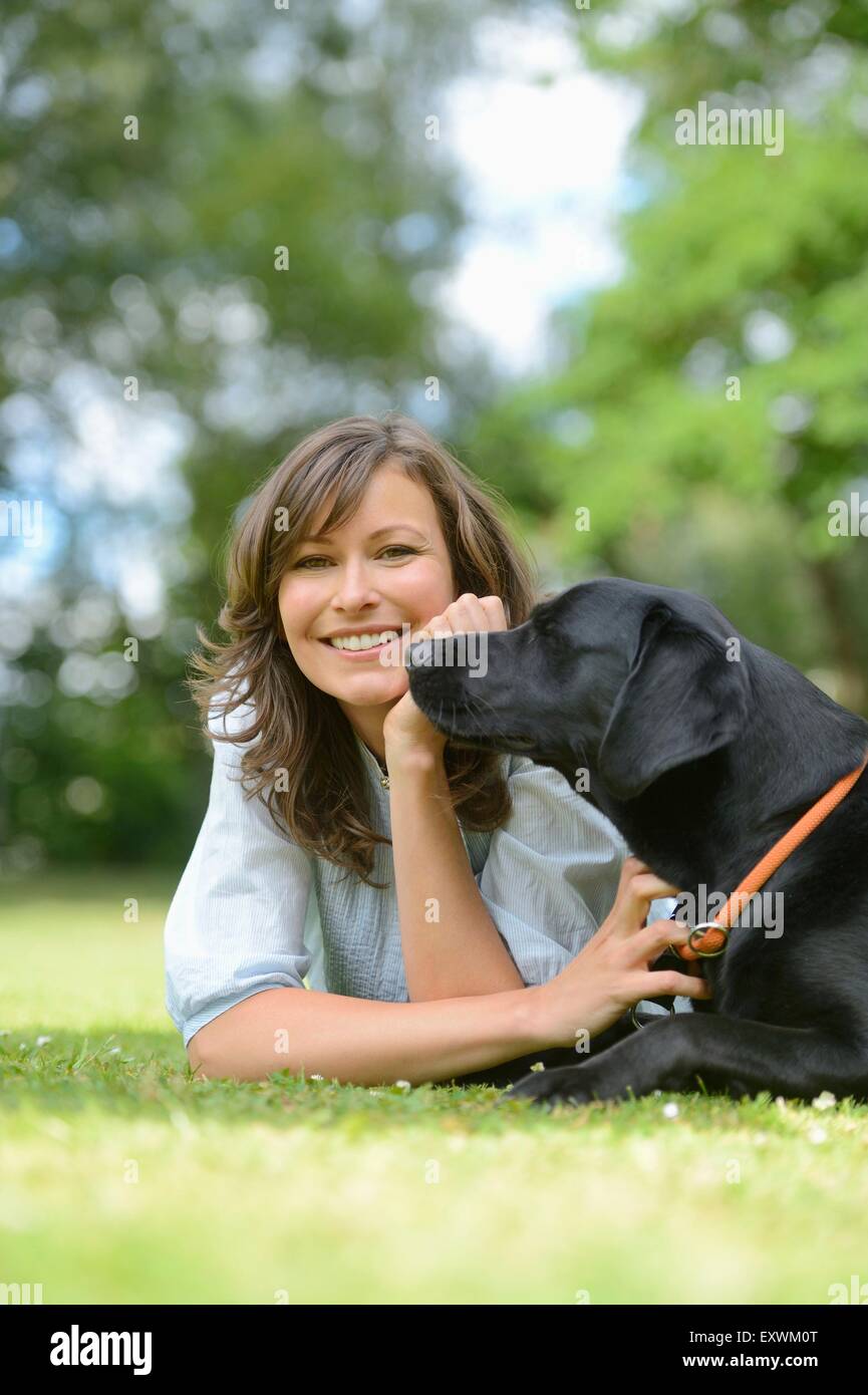 Woman black labrador retriever dog hi-res stock photography and images ...