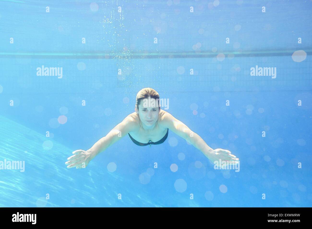 Woman swimming in outdoor pool hi-res stock photography and images - Alamy