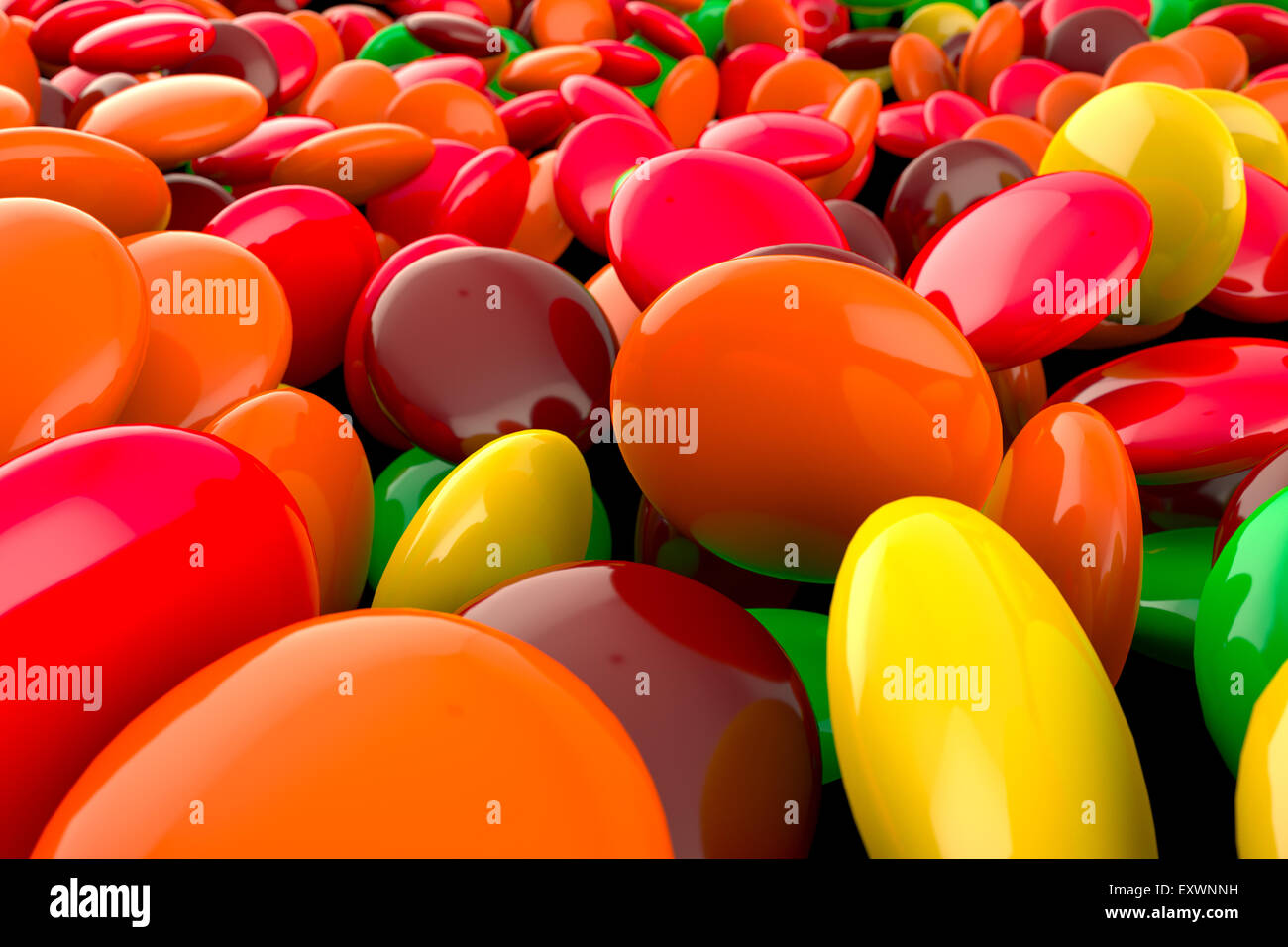 A pile of colorful candy which resemble Skittles or the UKs Smarties ...
