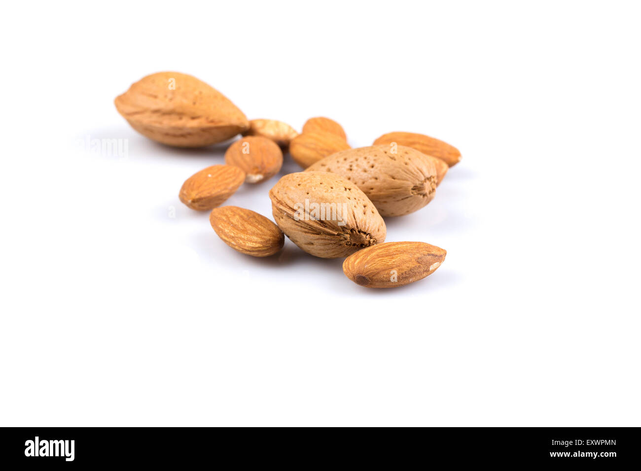 Dried almonds isolated on a white background Stock Photo - Alamy