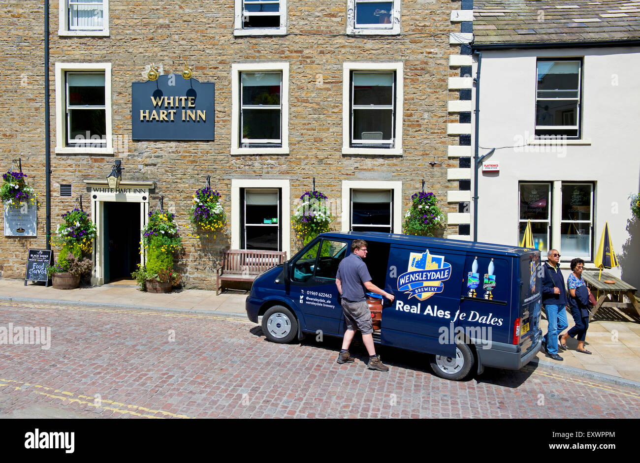 Man delivering beer to the White Hart Inn, Hawes, Wensleydale ...