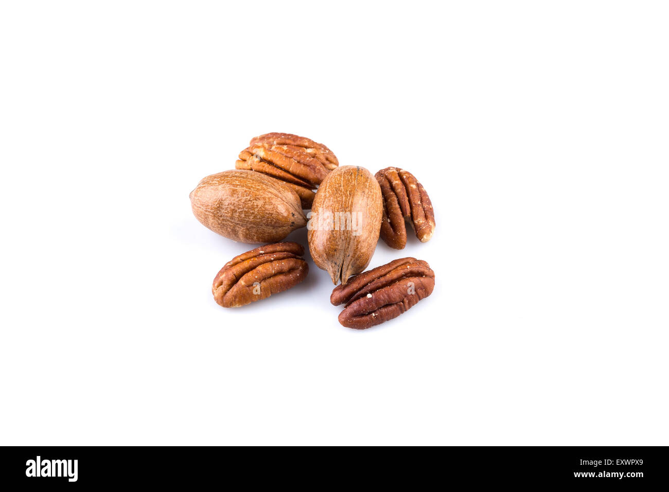 Few pecan nuts isolated on white background Stock Photo - Alamy