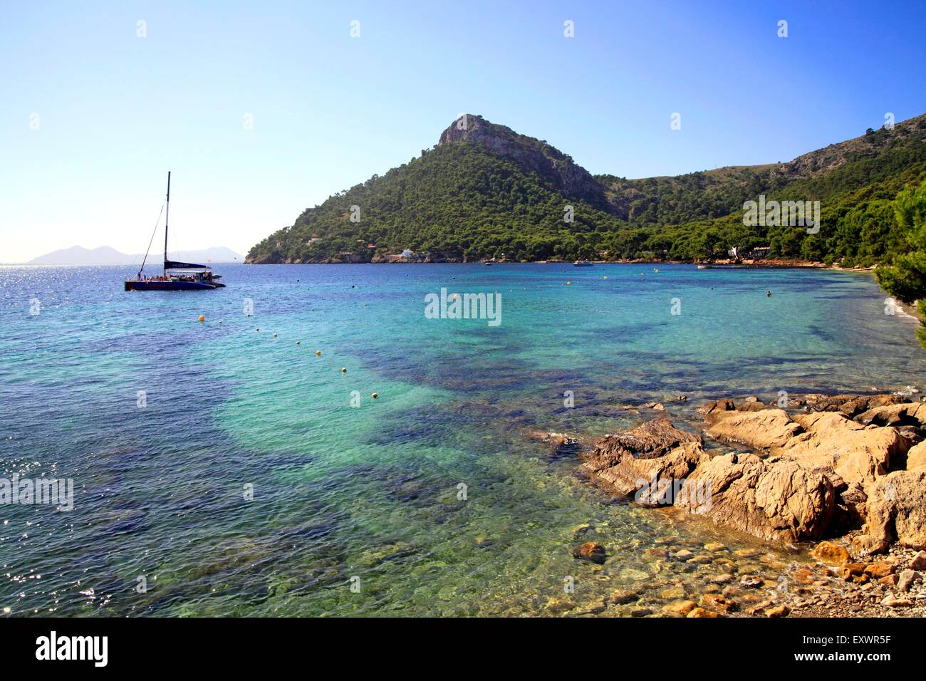 Sailing boat in the bay of Pollenca at the beach of Formentor, Majorca ...