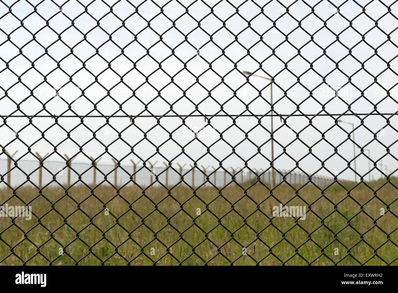 Security fence at a former WW2 and Cold-War radar base Stock Photo - Alamy