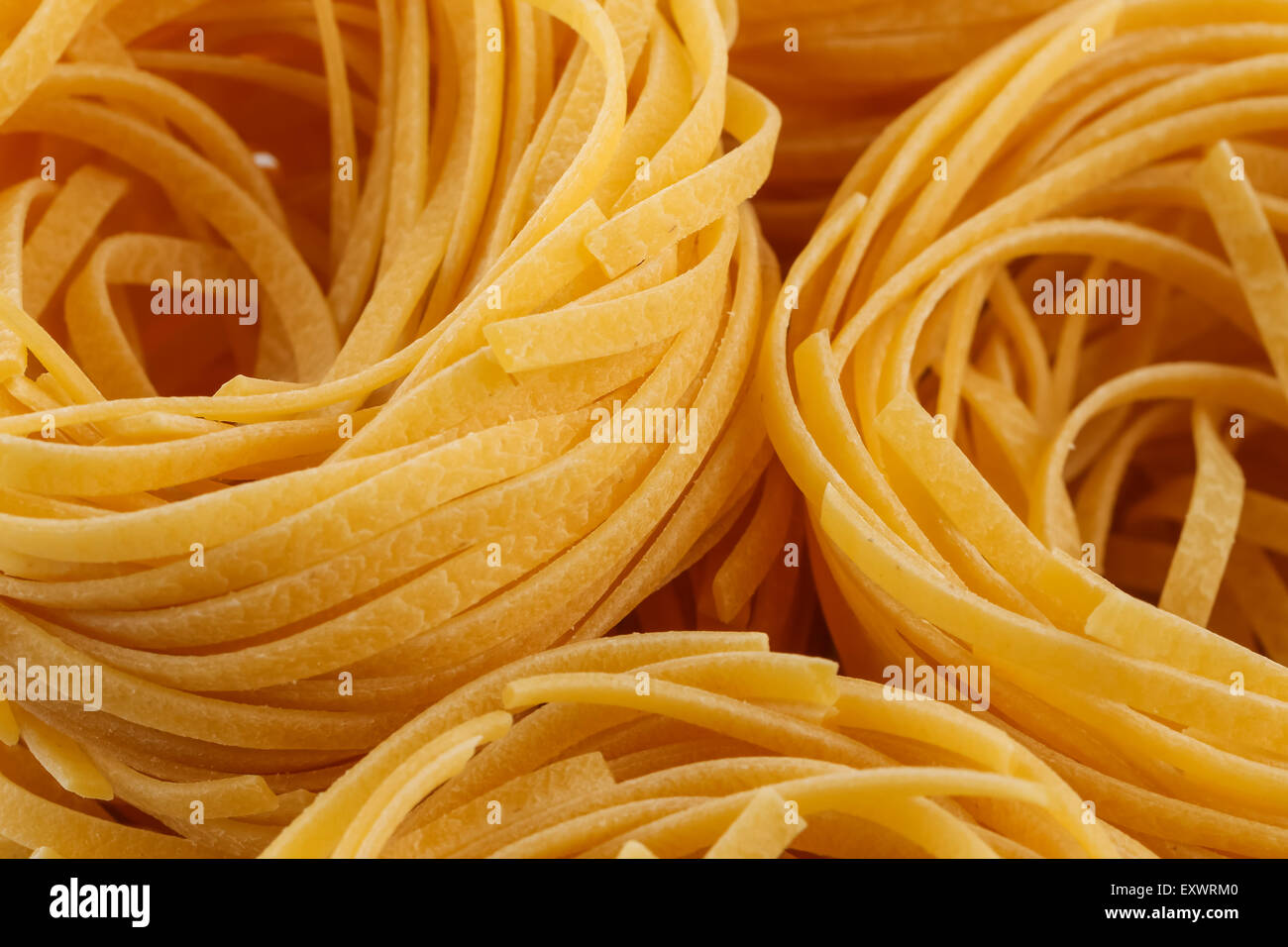 Dried tagliatelle pasta nests hi-res stock photography and images - Alamy